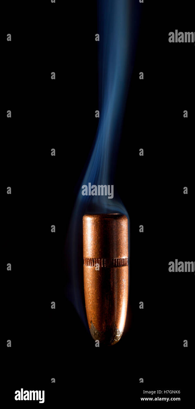 Copper colored lead bullet that looks like it is falling Stock Photo ...