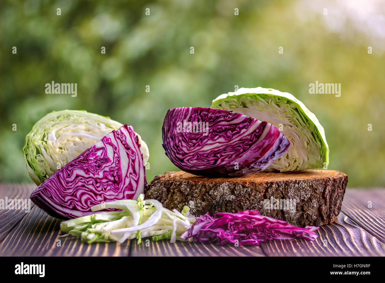 white and red cabbage and chopped white and red cabbage on wooden ...