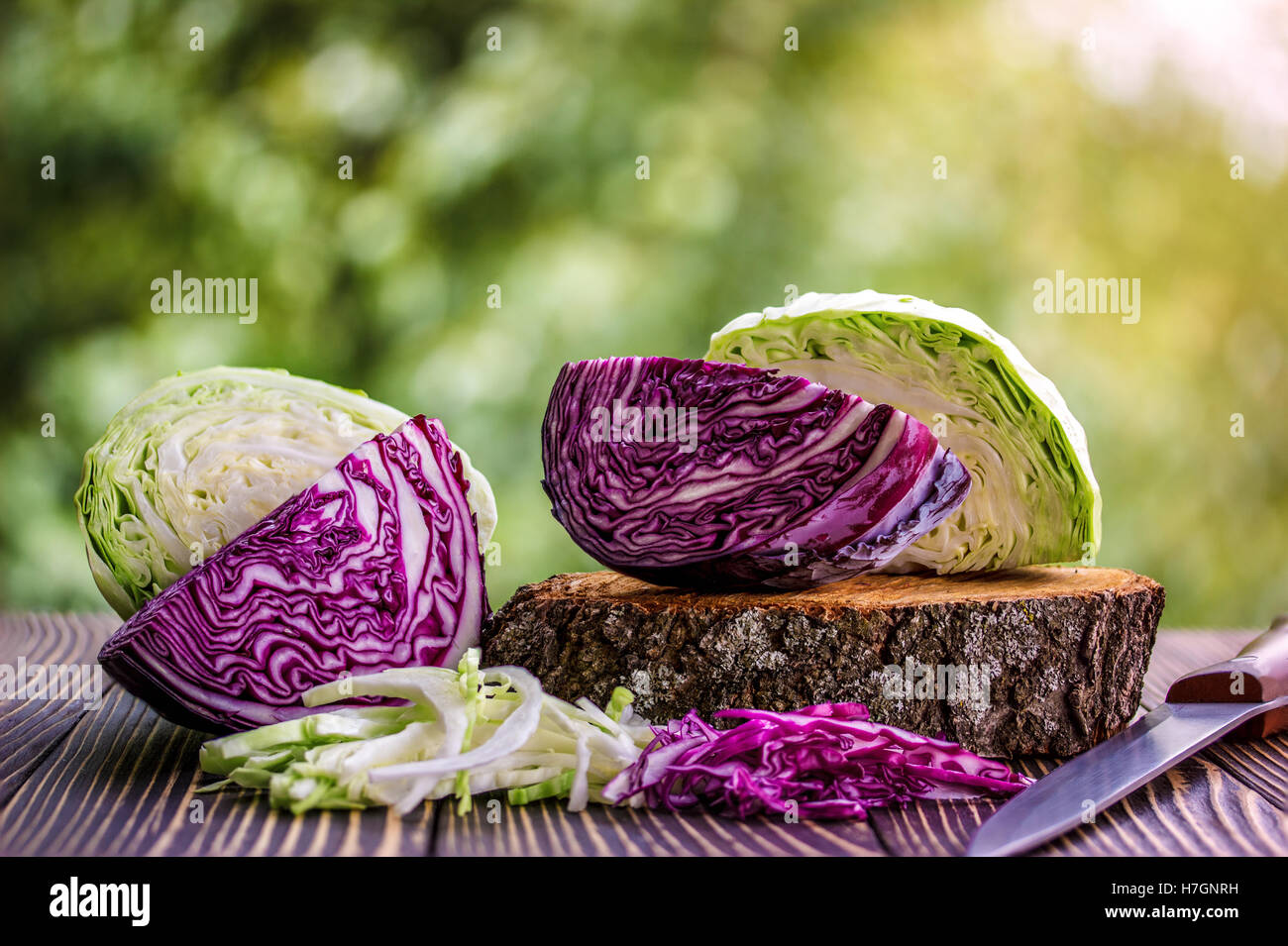 white and red cabbage and chopped white and red cabbage on wooden ...