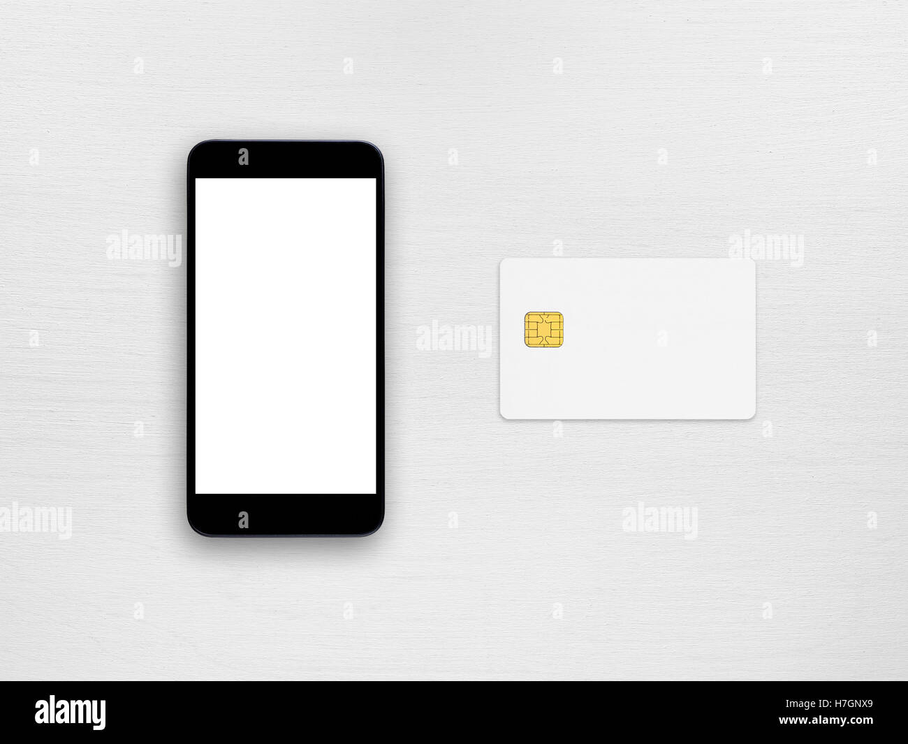 Smartphone and credit card on white table top view Stock Photo - Alamy