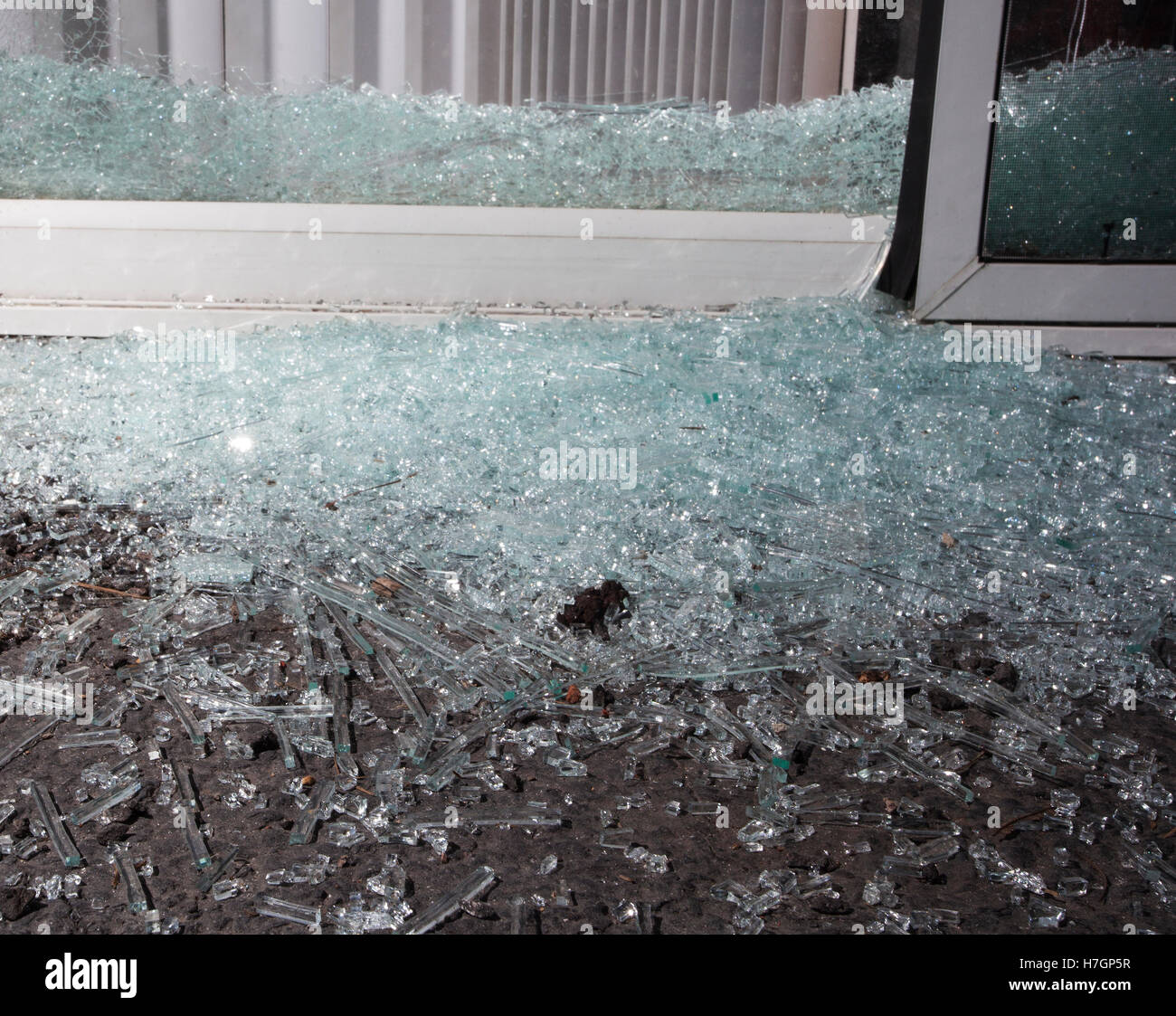 Broken sliding glass door used to enter a home Stock Photo - Alamy