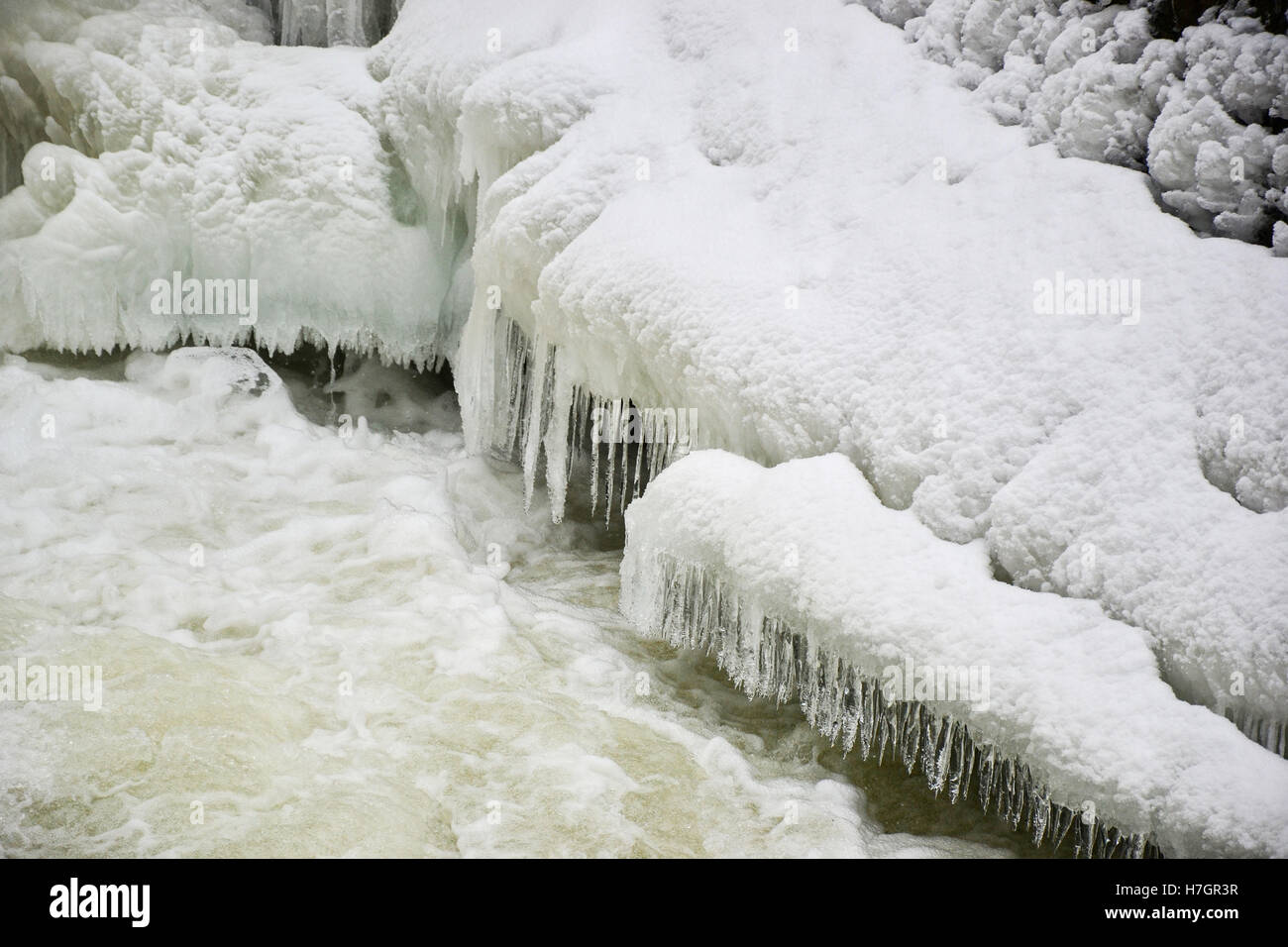 Frozen water on the river at the dam Stock Photo - Alamy