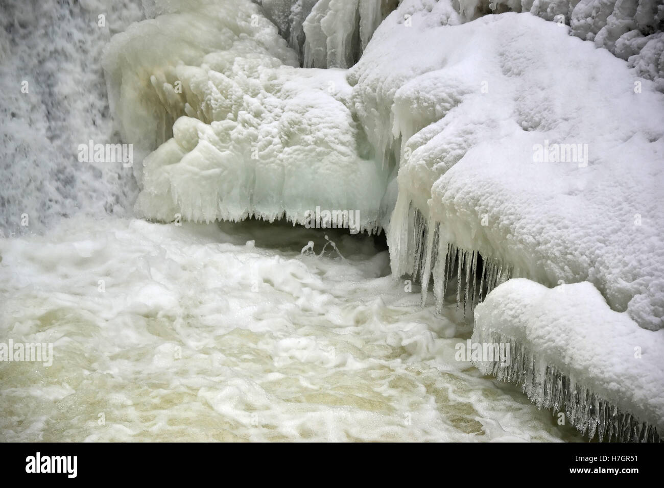Frozen water on the river at the dam Stock Photo - Alamy