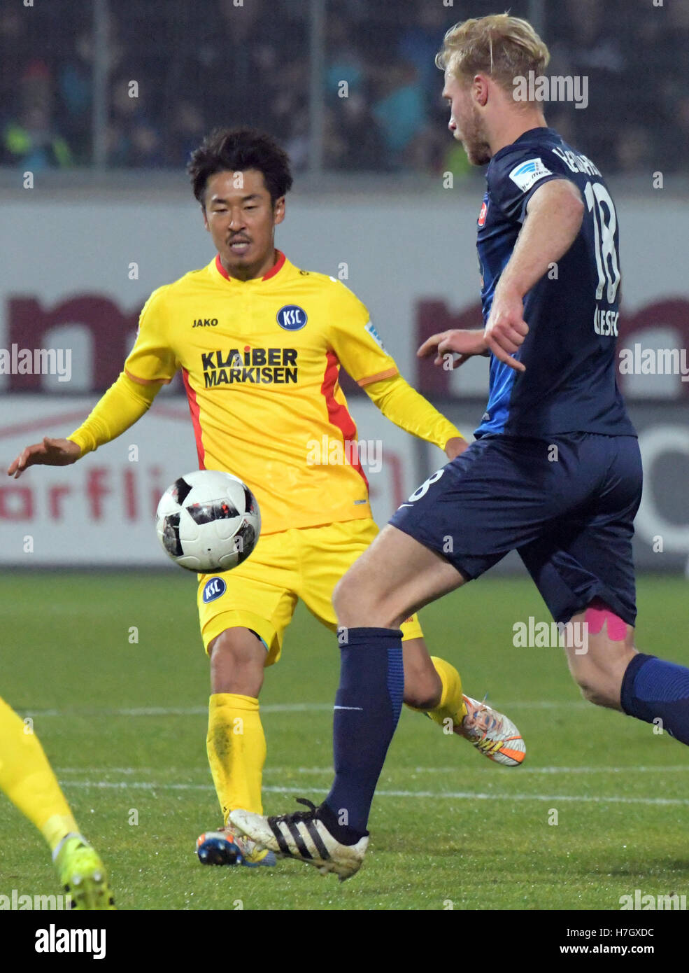 Heidenheim's Sebastian Griesbeck (r) and Hiroki Yamada of Karlsruhe ...