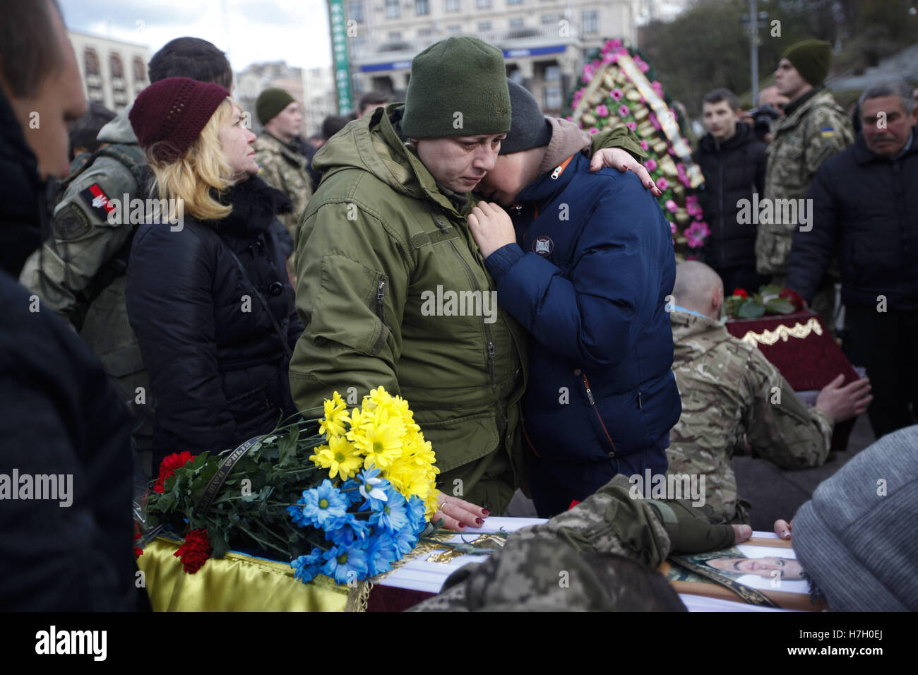 Kiev, Ukraine. 4th Nov, 2016. People mourn during the funeral ceremony for Ukrainian volunteers ...