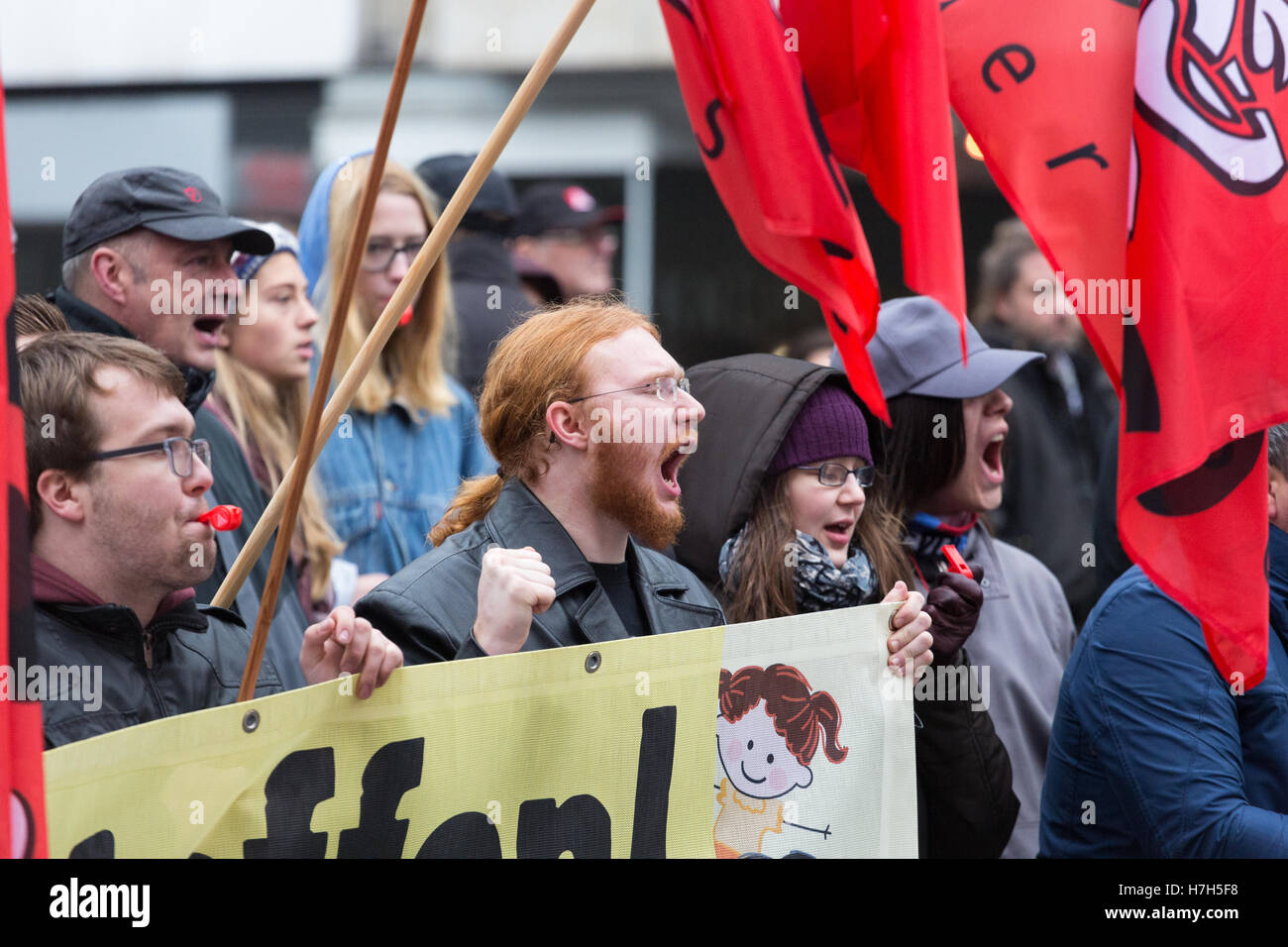 Protesters shout slogans at a left-wing rally in Bielefeld, Germany ...