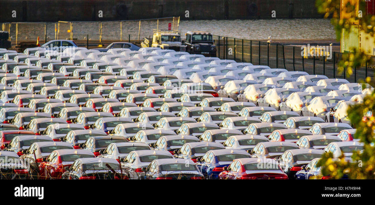 Cars waiting to be loaded at dock; New Luxury British made cars under ...
