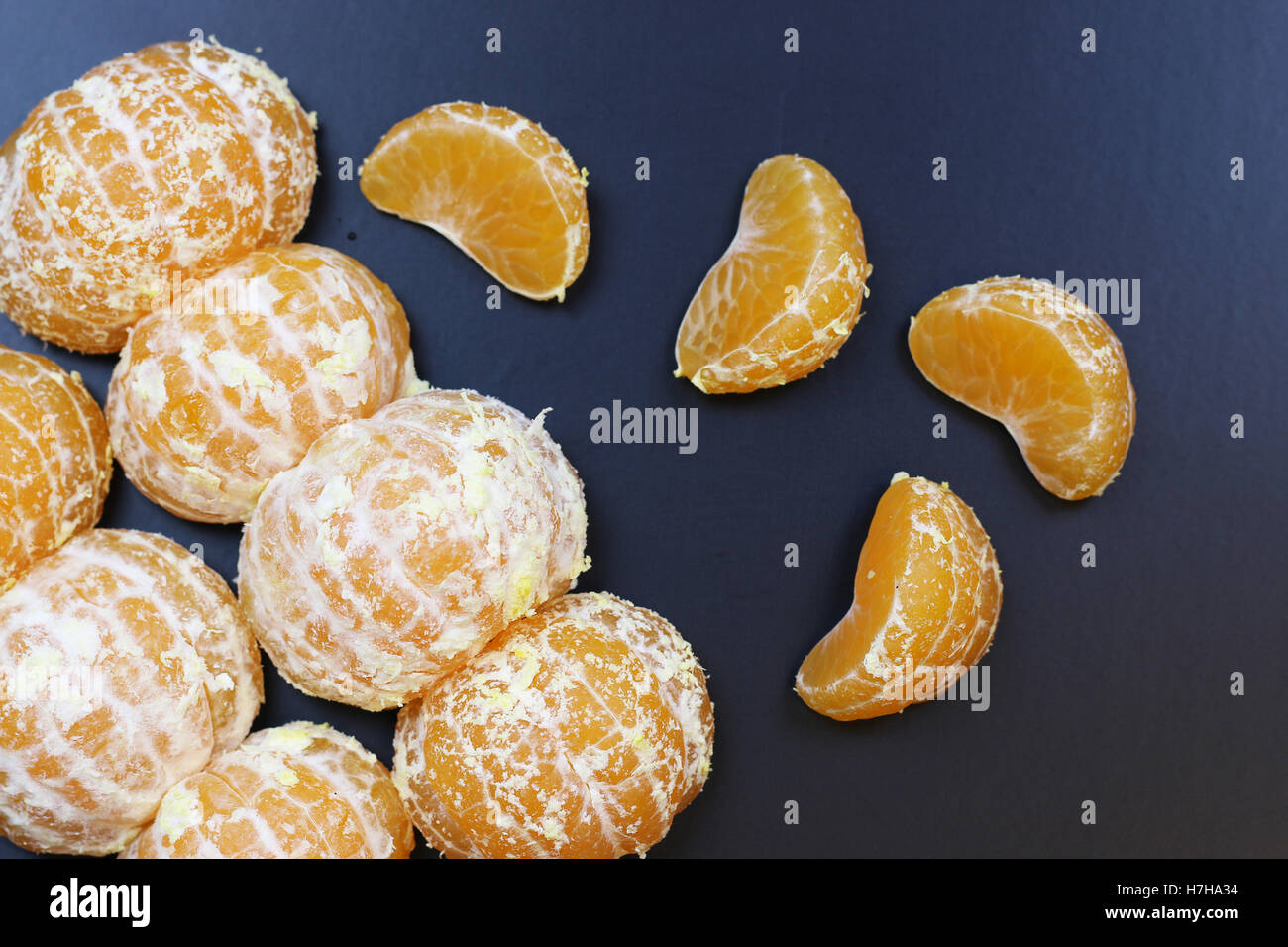 mandarin fruit isolate black Stock Photo - Alamy