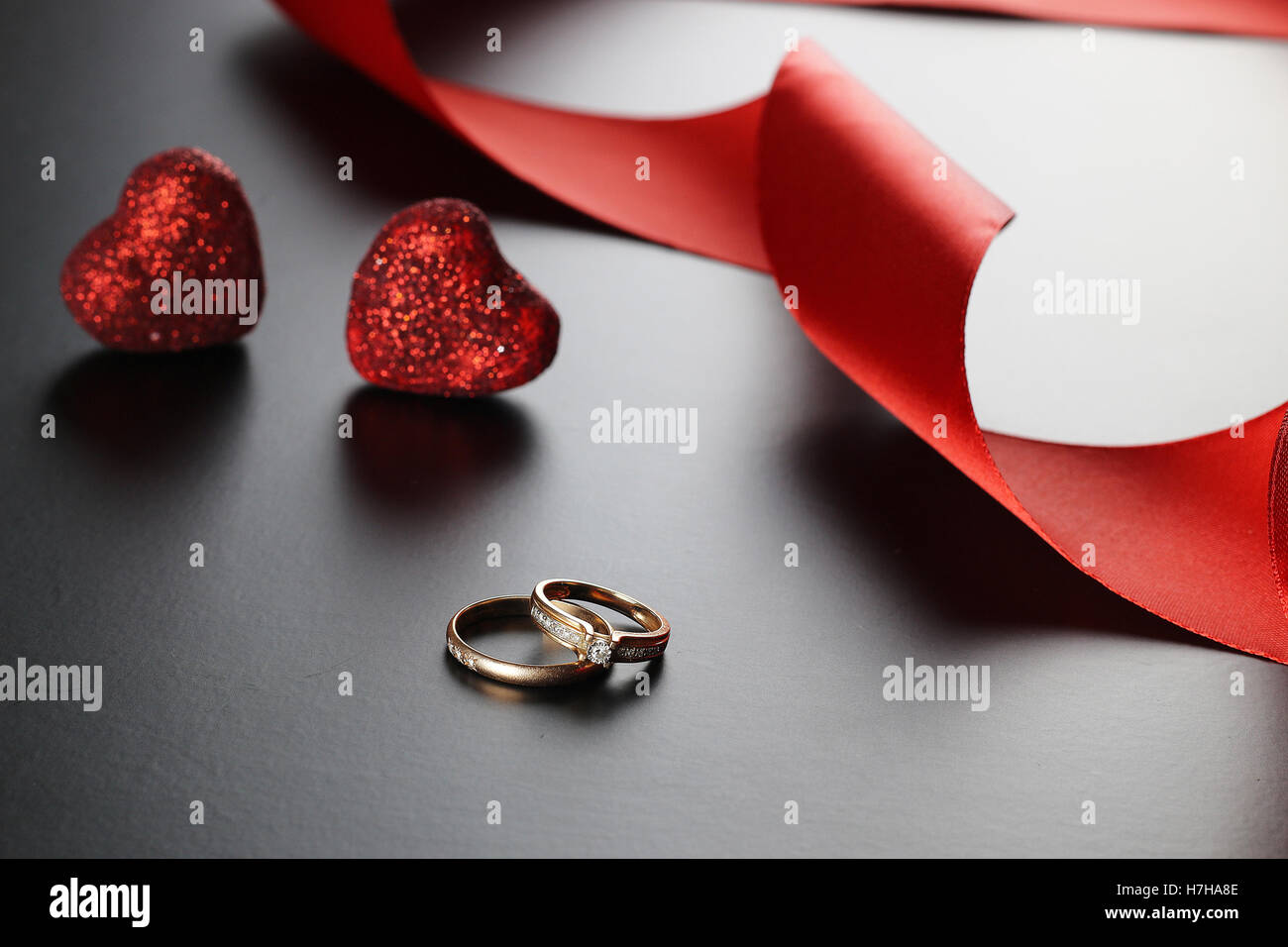 Wedding rings ribbon Stock Photo - Alamy
