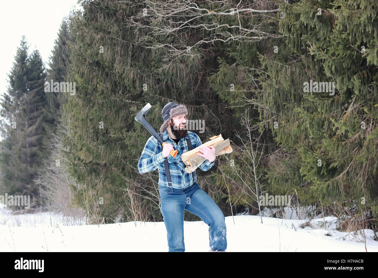 man in winter with axe Stock Photo - Alamy