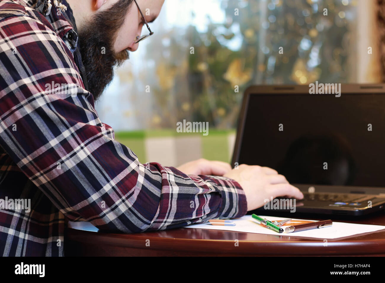 male notebook work bearded Stock Photo - Alamy