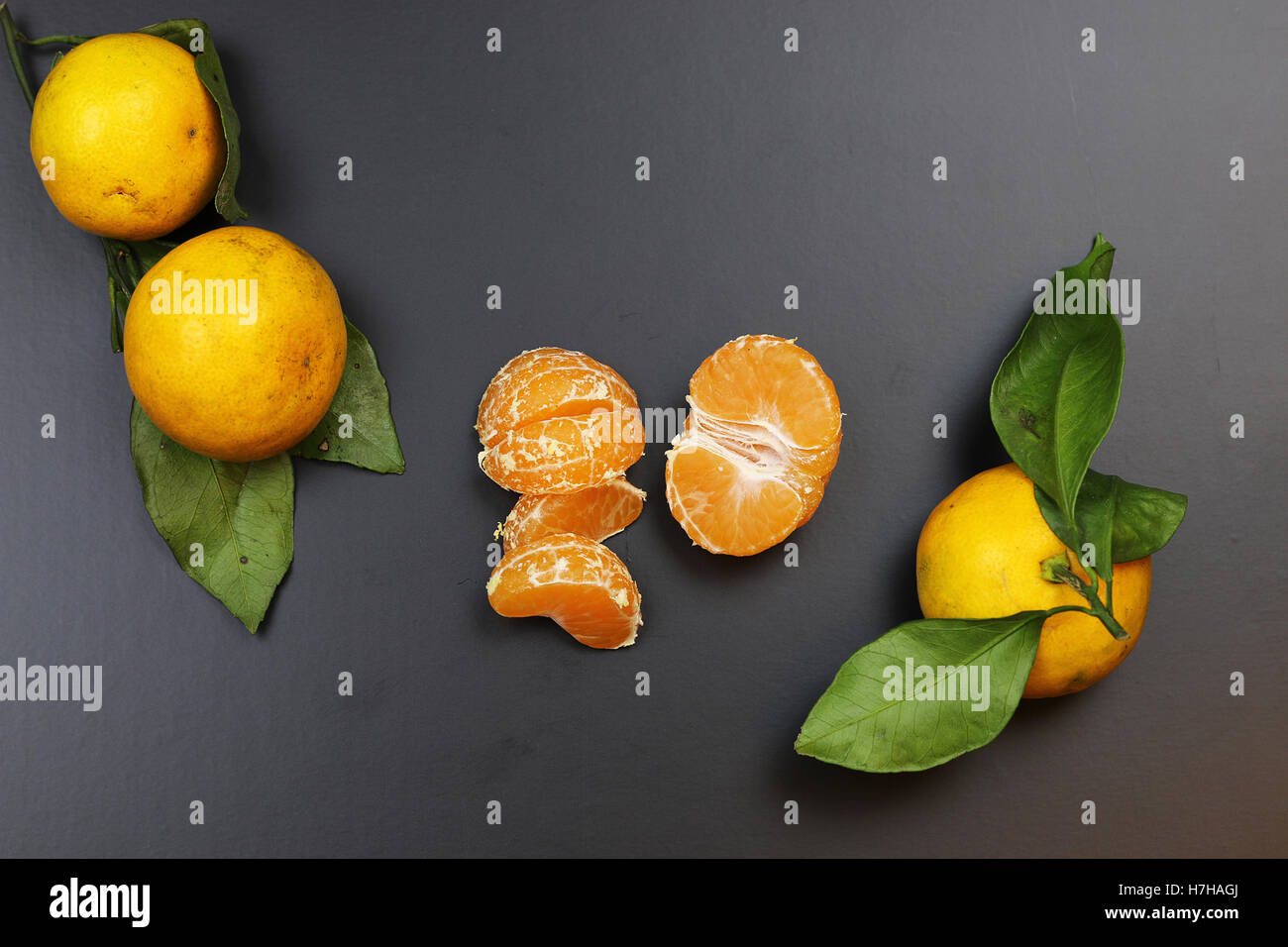 mandarin fruit isolate black Stock Photo - Alamy