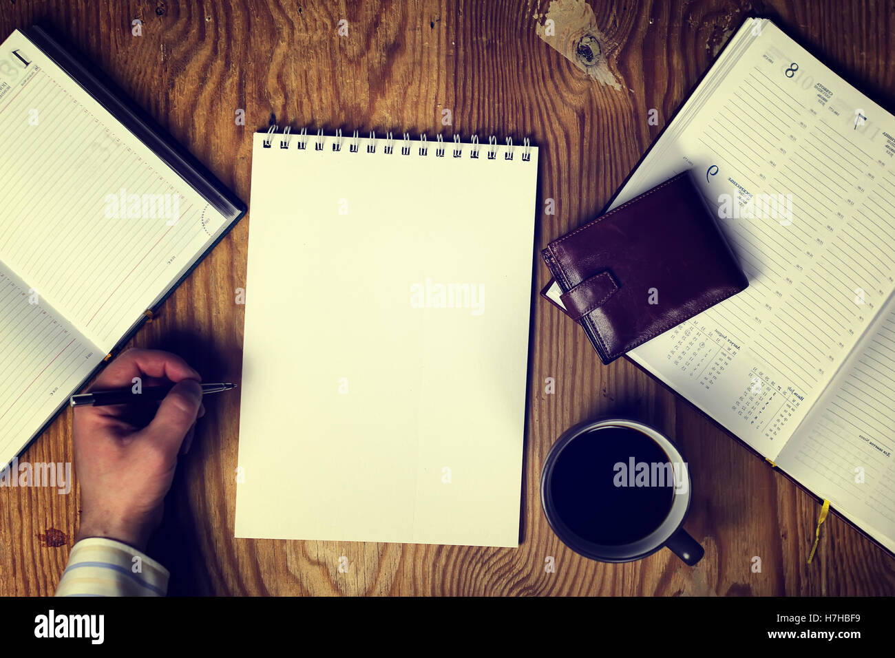 toned table write hand top view Stock Photo - Alamy