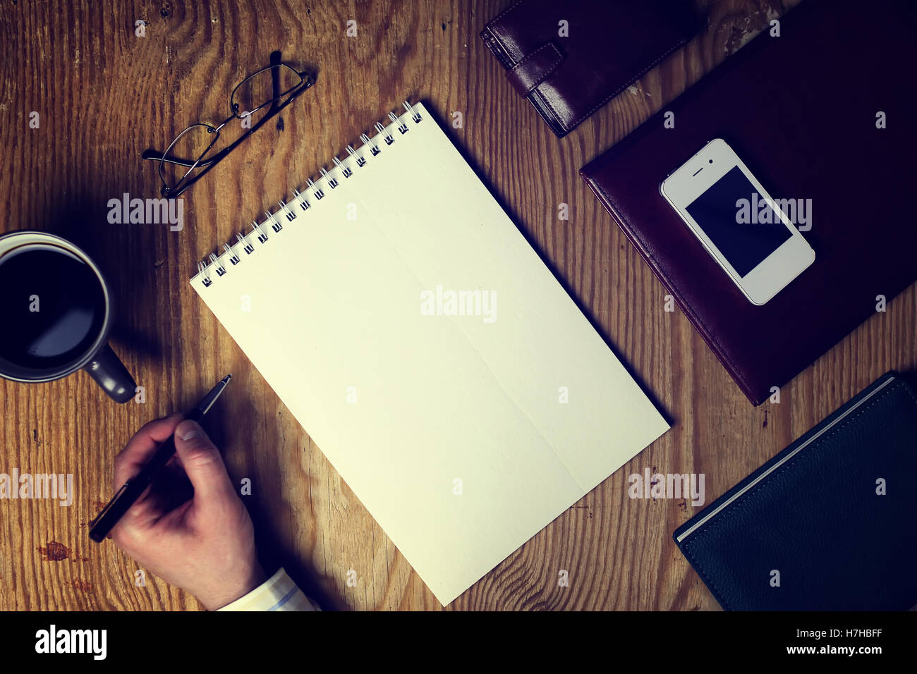 toned table write hand top view Stock Photo - Alamy