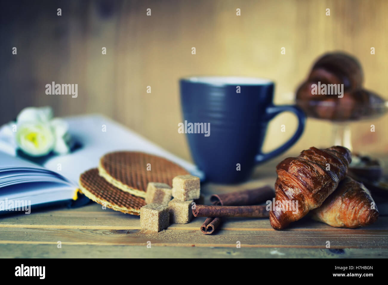tea cup croissant book Stock Photo - Alamy