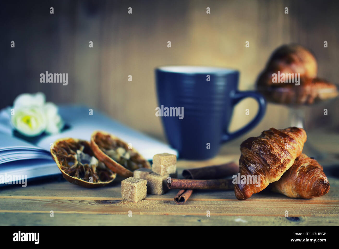 tea cup croissant book Stock Photo - Alamy