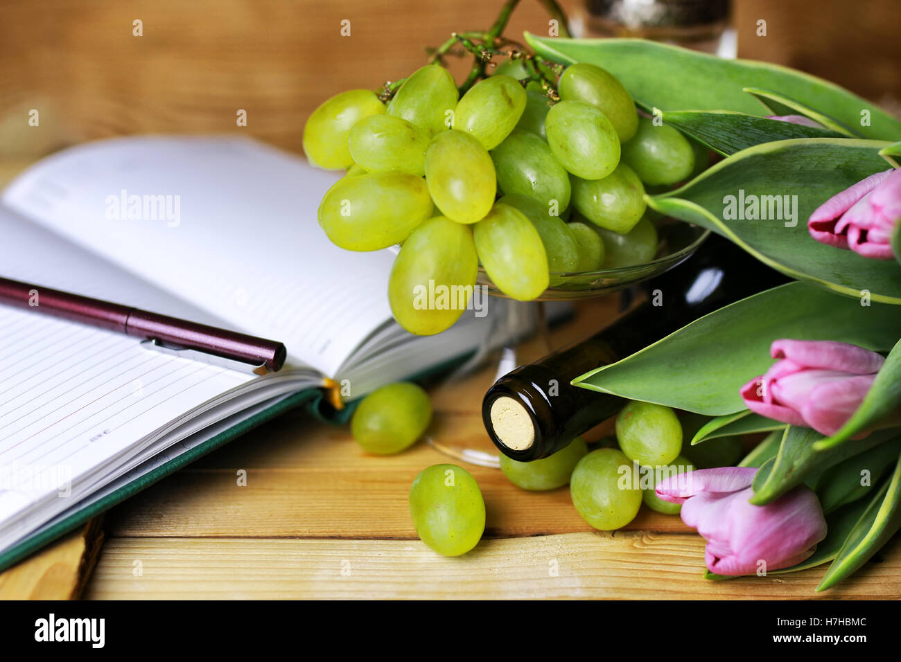 wine bottle book and glass grape Stock Photo - Alamy