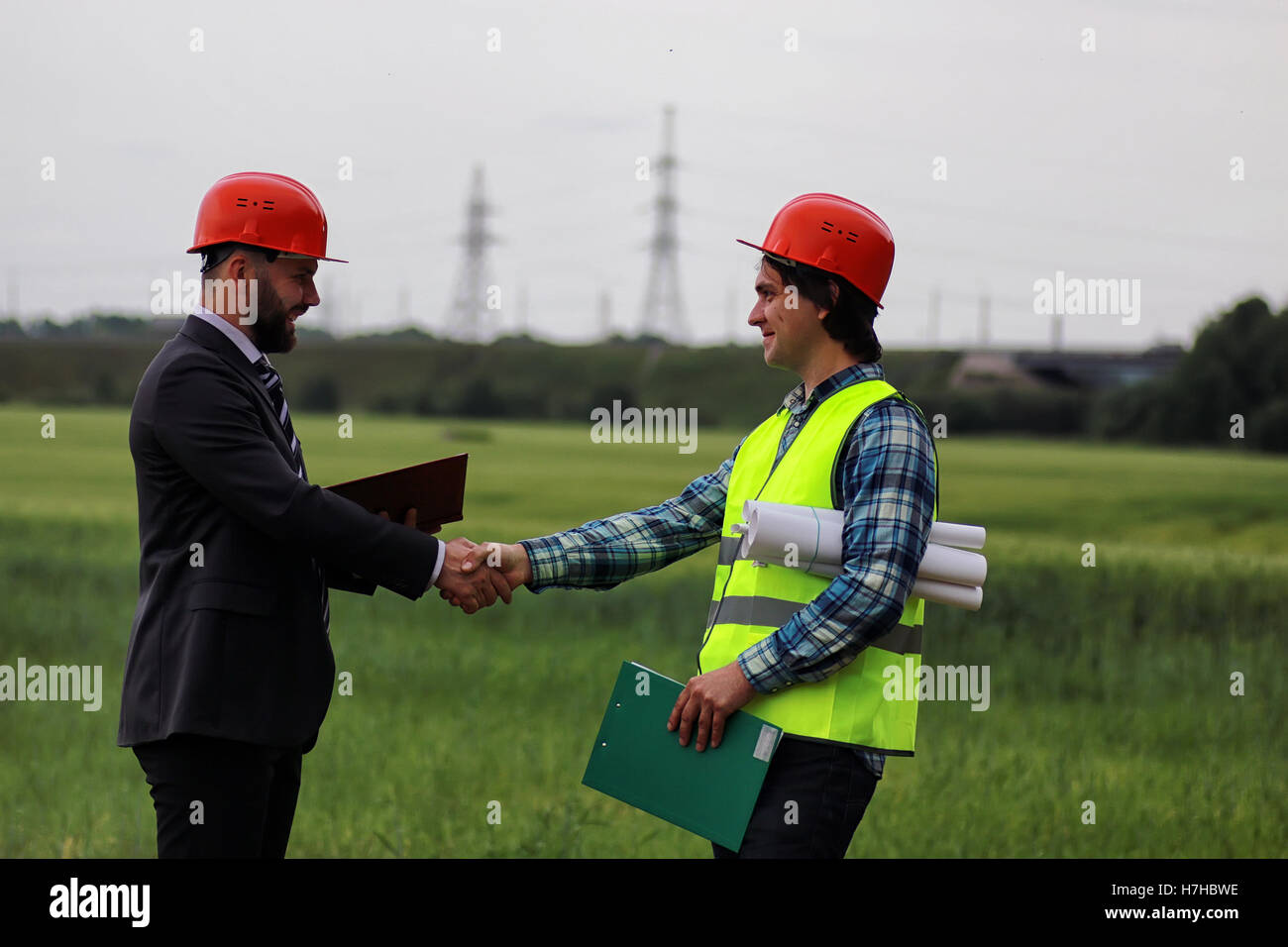 construction two man in the field Stock Photo - Alamy