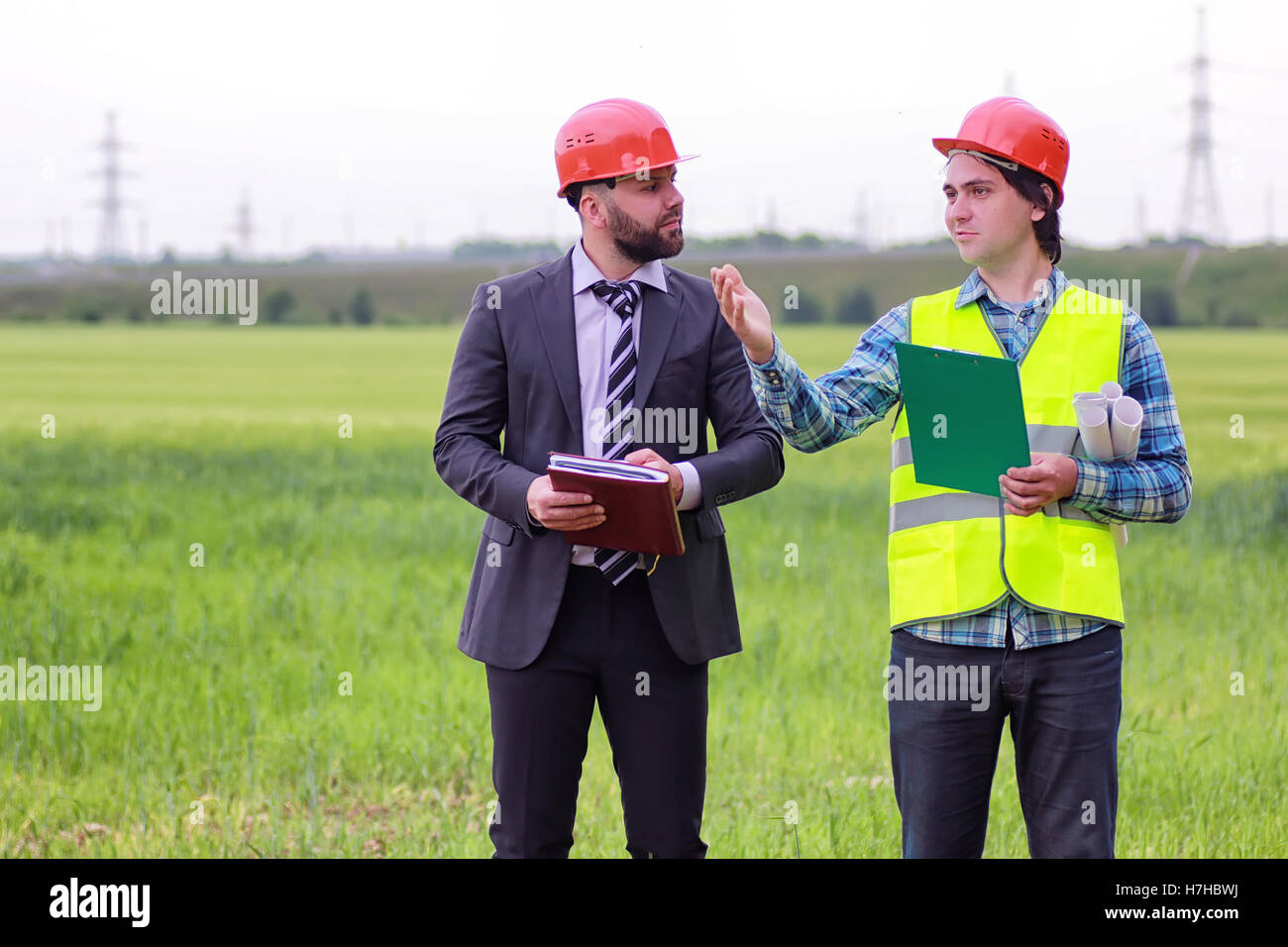 construction two man in the field Stock Photo - Alamy
