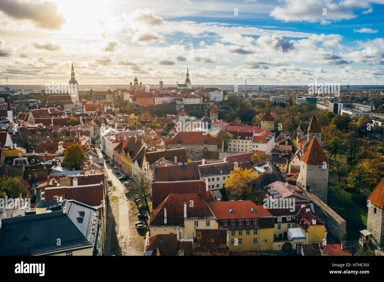 Tallinn city from above view against sun and cloudscape. Sunlit old ...