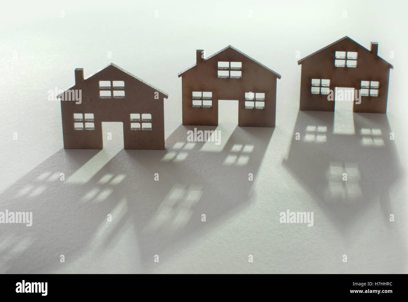 Row of three small houses Stock Photo - Alamy