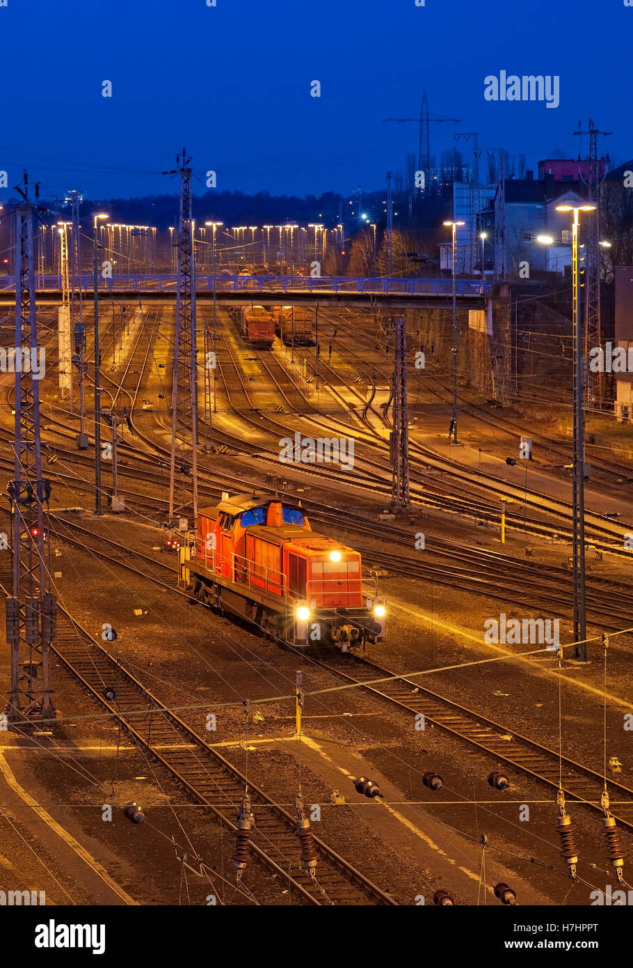 A lone locomotive running in the freight train depot, Hagen, Ruhr ...
