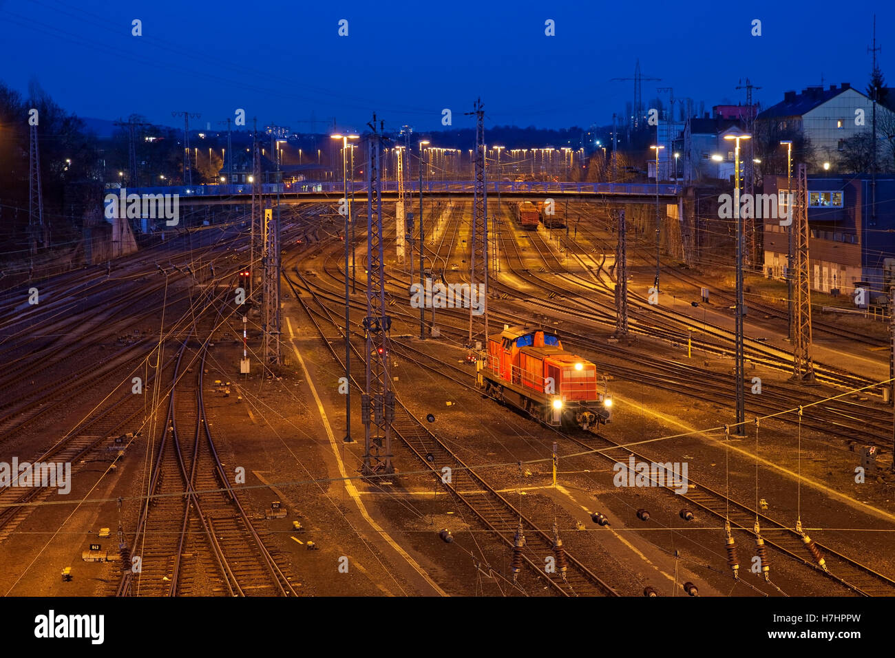 A lone locomotive running in the freight train depot, Hagen, Ruhr ...
