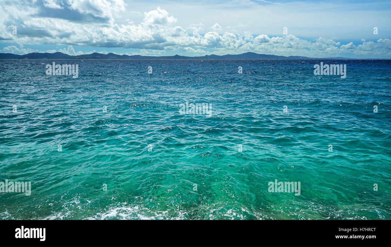 Beautifulness of the blue sea with the background of cloudy sky and ...