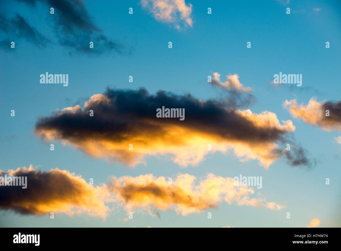 Puffy and colorful sunset clouds Stock Photo - Alamy