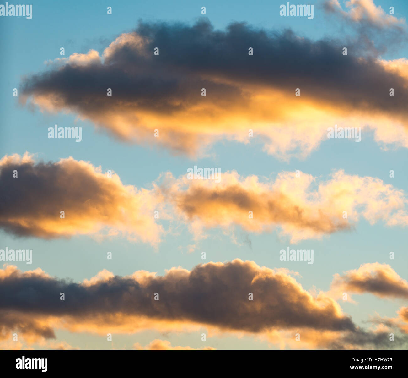 Puffy and colorful sunset clouds Stock Photo - Alamy