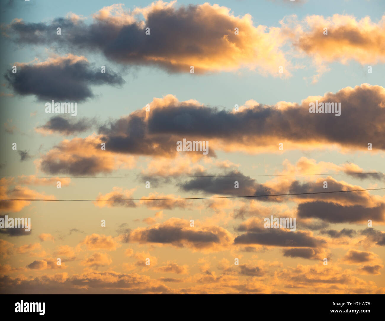 Puffy and colorful sunset clouds Stock Photo - Alamy