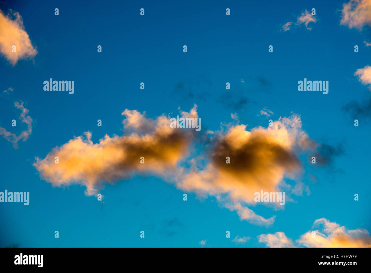 Puffy and colorful sunset clouds Stock Photo - Alamy