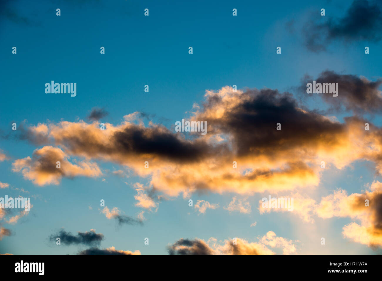 Puffy and colorful sunset clouds Stock Photo - Alamy
