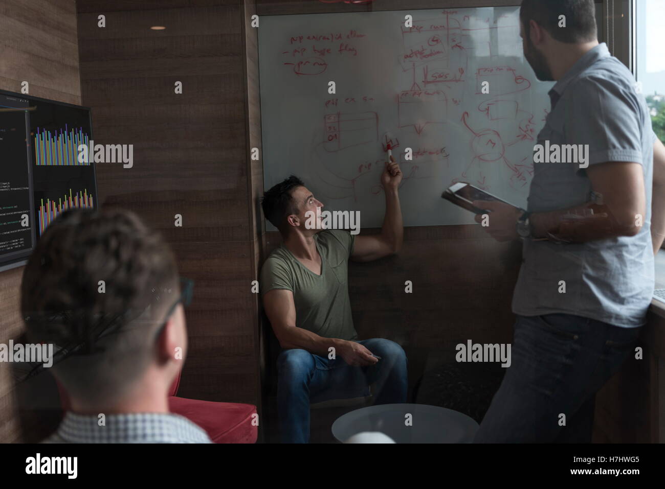 young people group in small private office have team meeting and ...