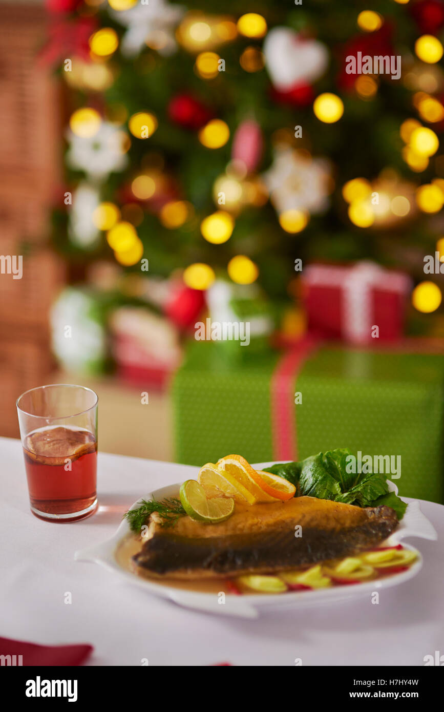 Traditional fish and Christmas tree in the background Stock Photo - Alamy