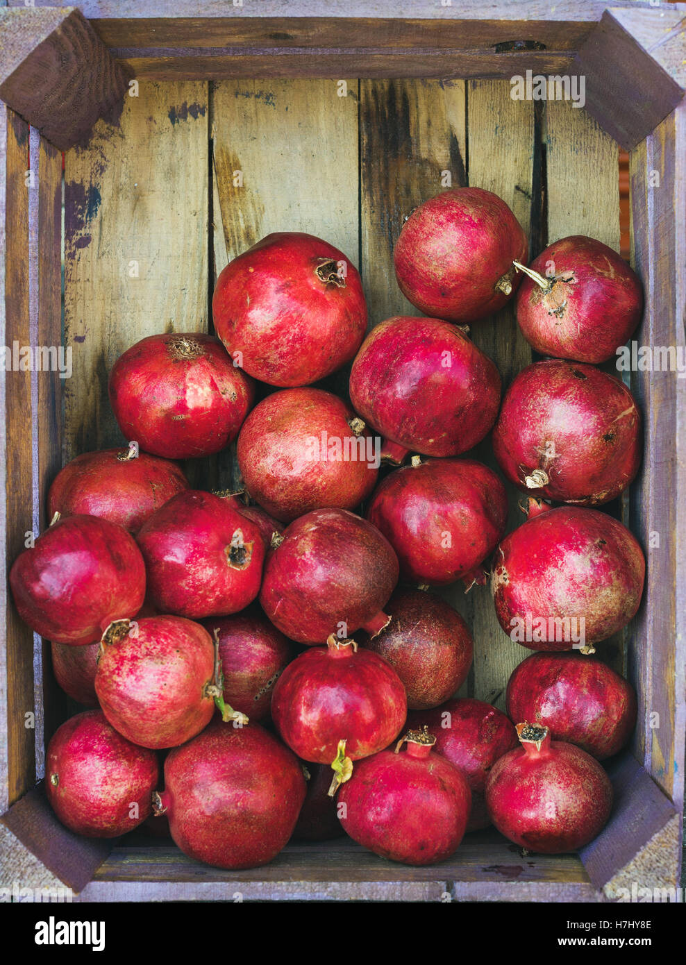 Pomegranate in wooden box hi-res stock photography and images - Alamy