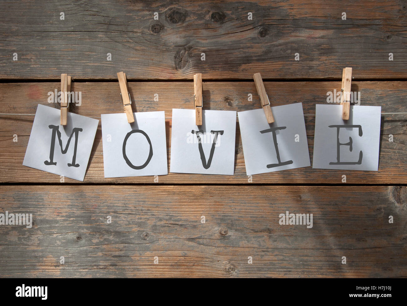 Movie spelt using notes hanging on washing line Stock Photo - Alamy