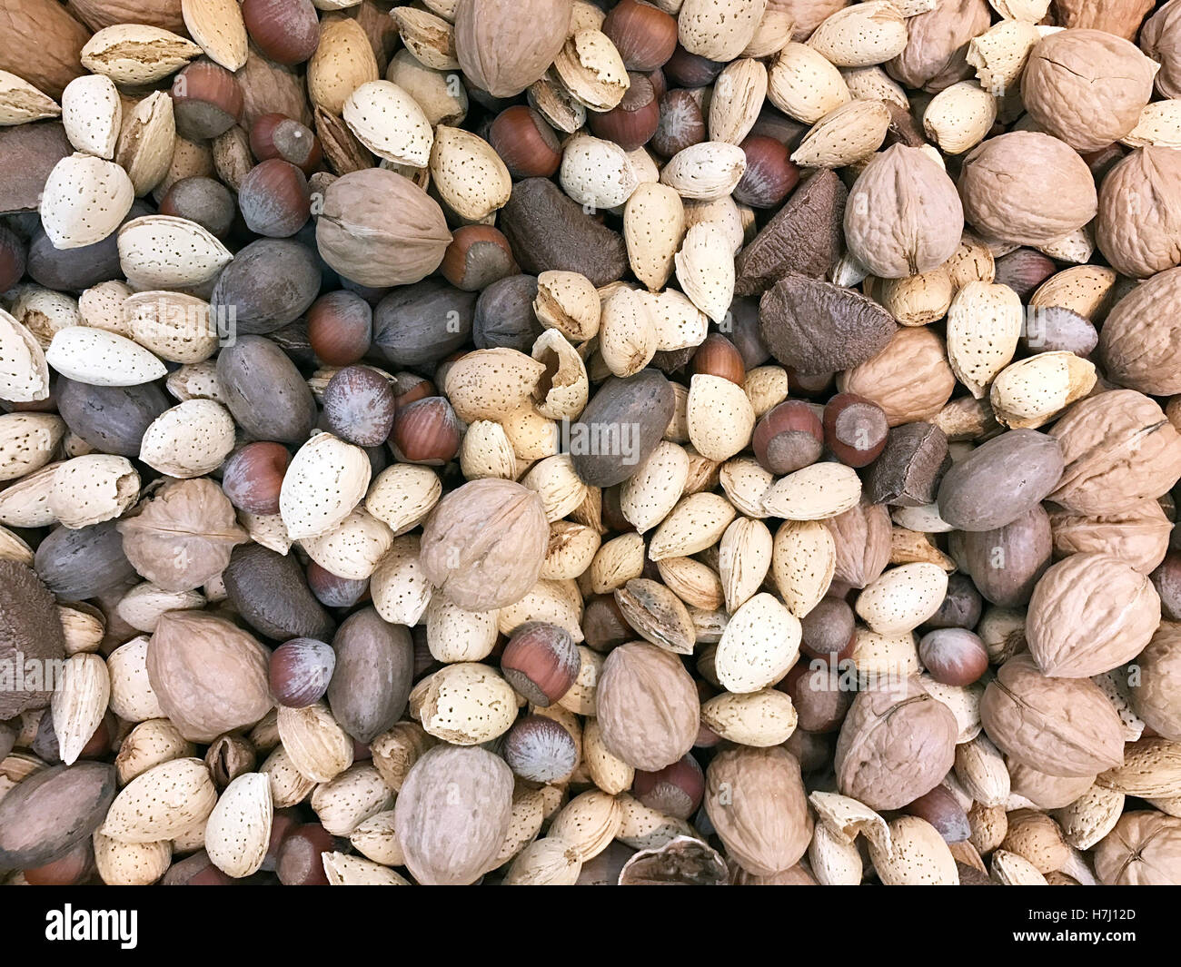 Several varieties of mixed nuts make a snack food background Stock ...