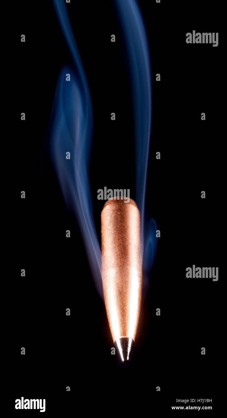 Polymer tipped bullet with copper and smoke that are coming at the ...