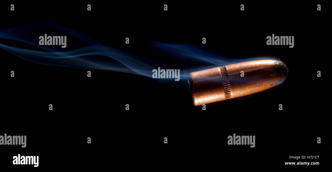 Bullet that looks like it is starting to tumble with smoke Stock Photo ...