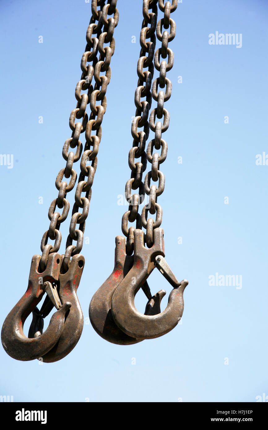 Long rusty chains with crane hook as industrial background Stock Photo ...