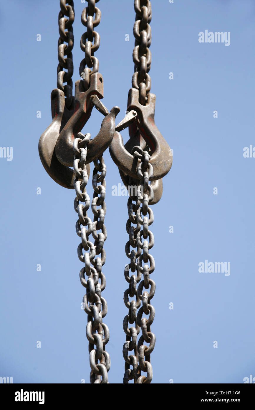 Long metal chains hanging vertically against blue sky Stock Photo - Alamy