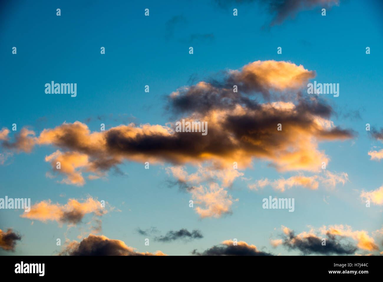 Puffy and colorful sunset clouds Stock Photo - Alamy