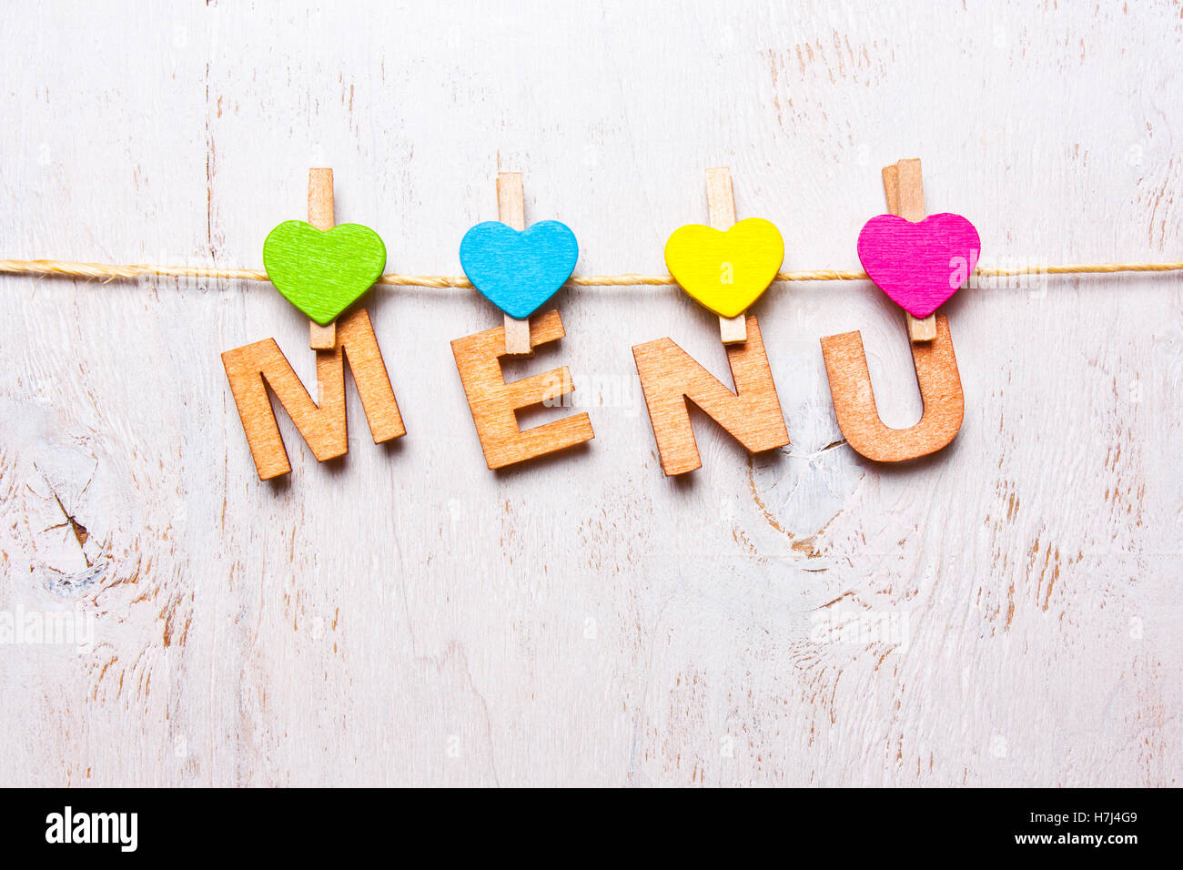 the word "menu" of the wooden letters on a white background Stock Photo ...