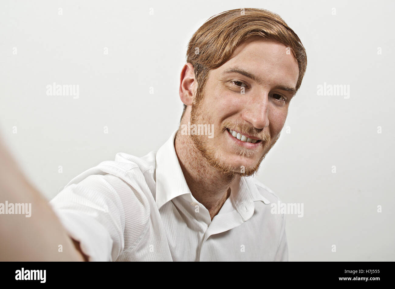 Young man taking selfie studio shot hi-res stock photography and images ...