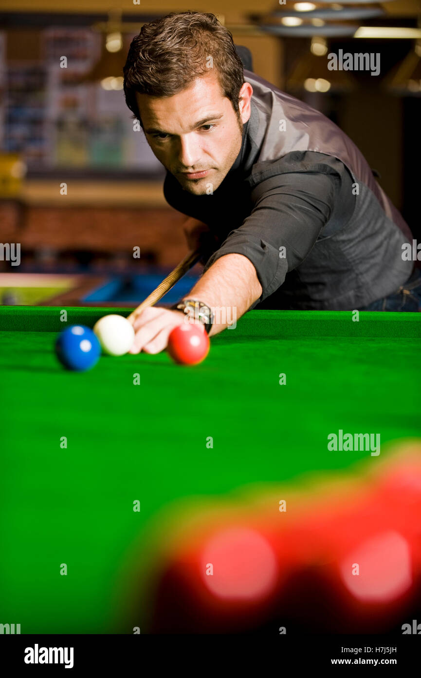 Man playing billiard Stock Photo - Alamy