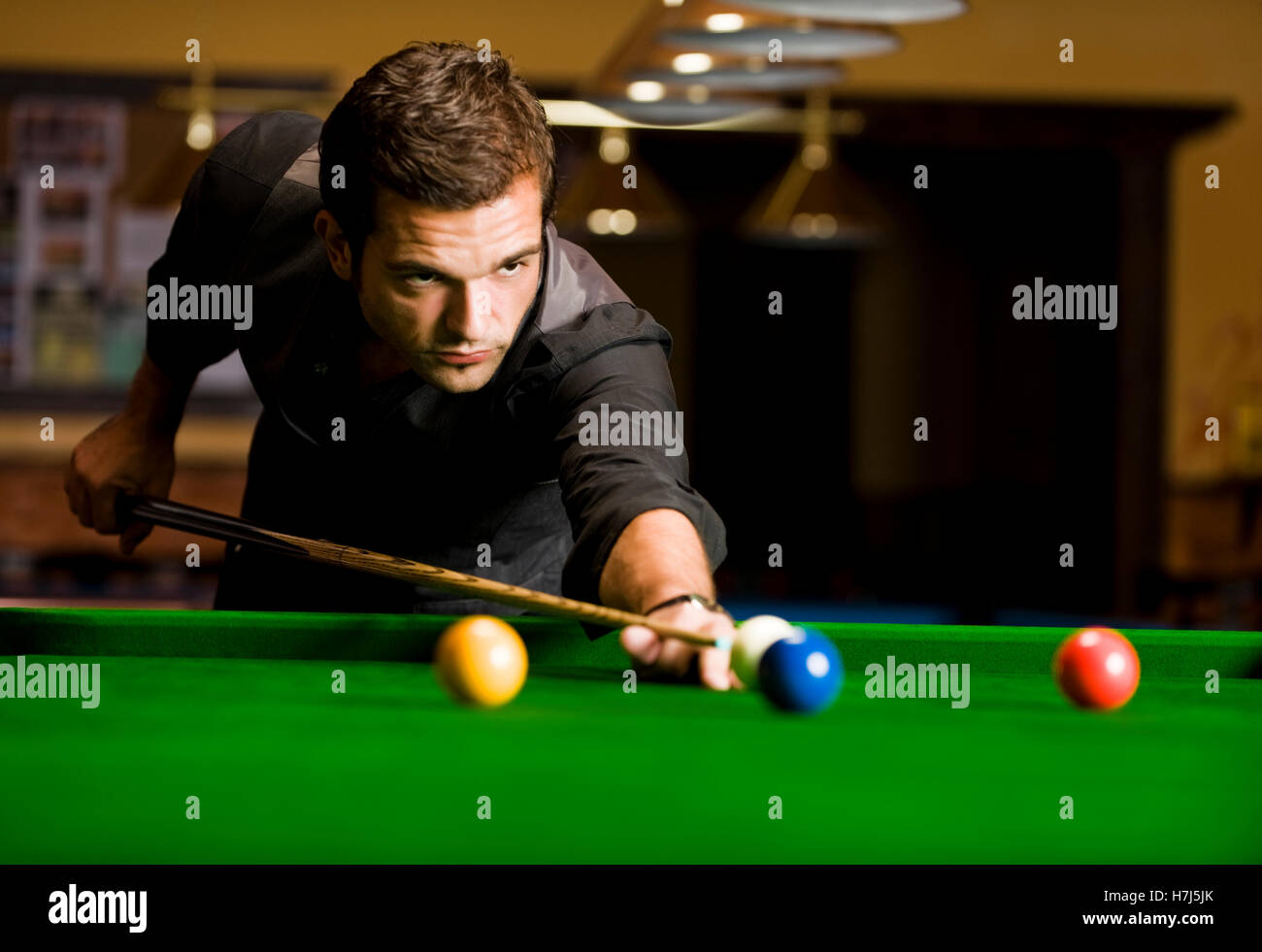 Man playing billiard Stock Photo - Alamy