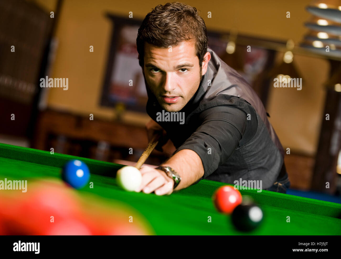Man playing billiard Stock Photo - Alamy