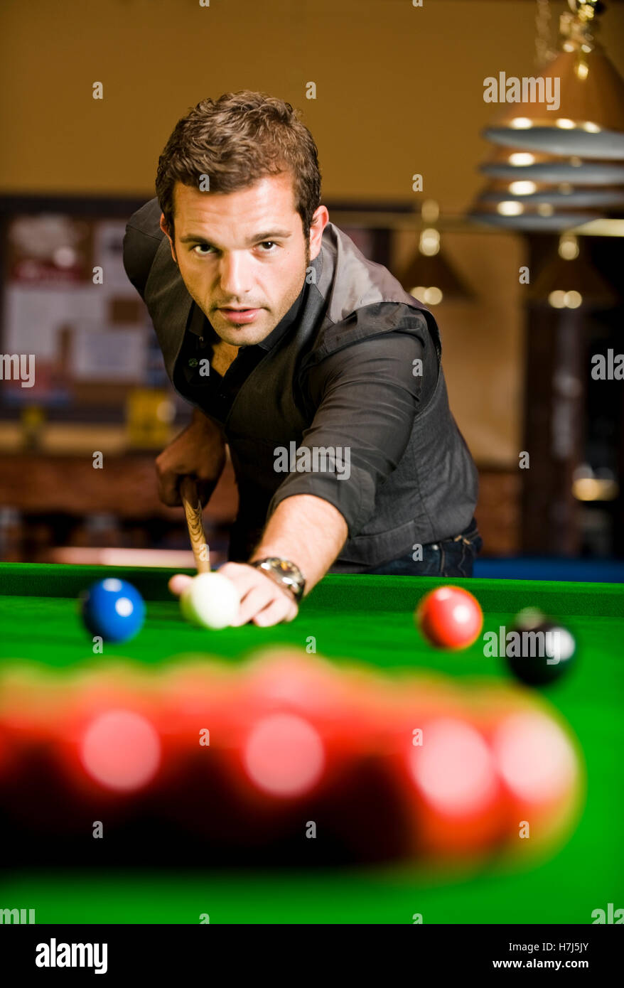 Man playing billiard Stock Photo - Alamy