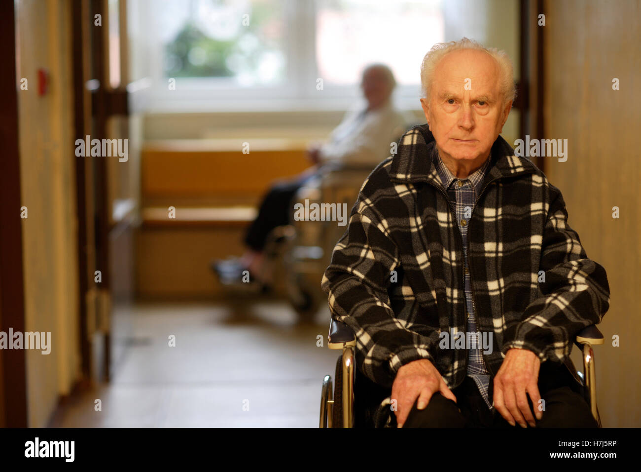 Nursing home, old man in a wheelchair Stock Photo - Alamy